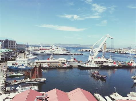 Premium Photo Ship Moored At Harbor Against Sky