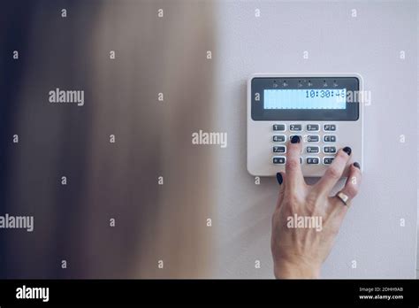 Security Home System Woman Entering Secret Code On Home Alarm Stock Photo Alamy
