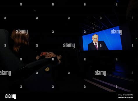 People Watch A Live Broadcast Of Russian President Vladimir Putins
