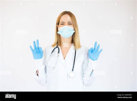 Beautiful Female Doctor Or Nurse Wearing Protective Mask And Latex Or