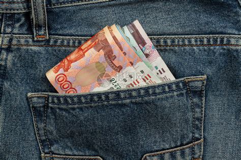从蓝色牛仔裤口袋里伸出的钞票高清图片下载 正版图片504446765 摄图网