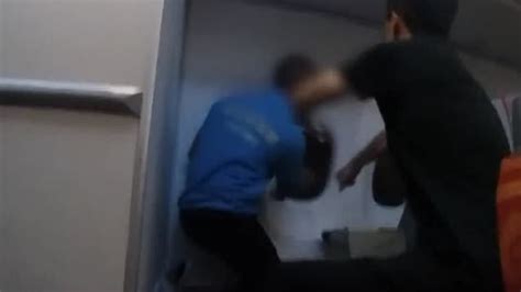 Watch Man Restrained After Trying To Smash Plane Window Open Door At