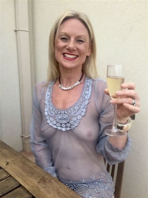 Mature Sitting With Wine Pic