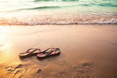 Flip Flops Or Sandals For Woman On Sand Beach At Coast Stock Image