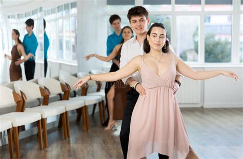 Hispanic Guy Practicing Bachata With Young Brunette In Dance Class
