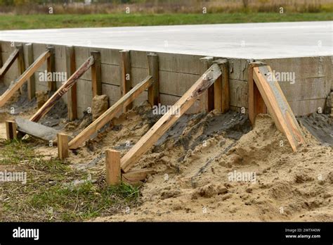 Home Construction Close Up Of Slab Foundation Formwork Supports Stock