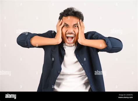 Portrait Of Disappointed Young Asian Man In Blue Shirt Annoyed Angry In
