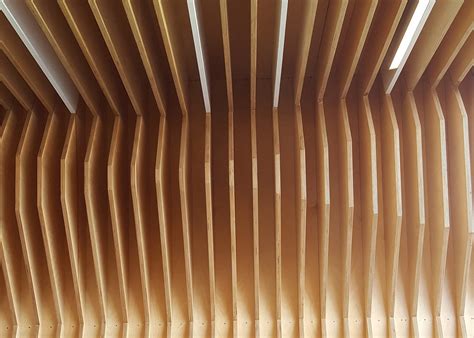 A Industrial Clads Juice Bar With Geometric Plywood