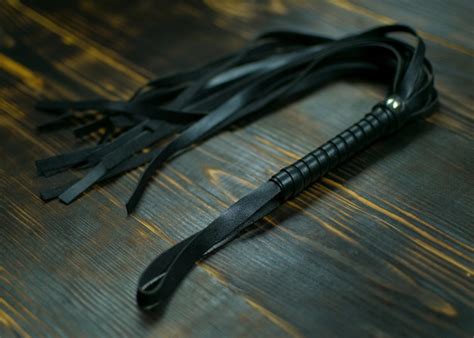Premium Photo Whip For Bdsm On A Dark Background Accessory For Sexual