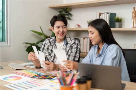 Ux And Ui Design Interaction Young Creatives Analyzing Color Samples And Discussing Layout