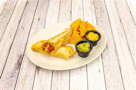 Premium Photo Chicken Fajitas Stewed With Cheddar Cheese Guacamole