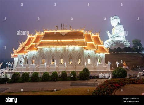 Illuminated At Dusk Architecture Is Splendid With The Mix Of Chinese Guan Yin Statue Dragon