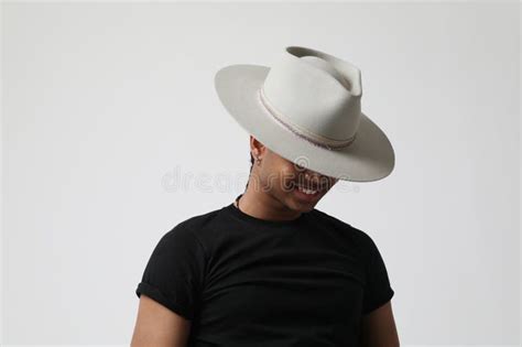 Happy And Handsome Dark Skinned Young Man Wearing Trendy Hat Isolated