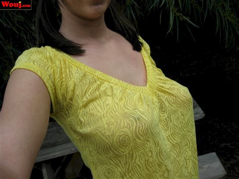 Amazing Brunette Babe Shows Her Hard Nipples Under A Yellow Shirt Photos