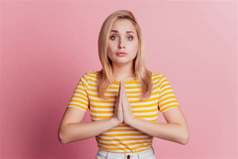 Portrait Of Dreamy Pleading Girl Hands Together Ask Help On Pink
