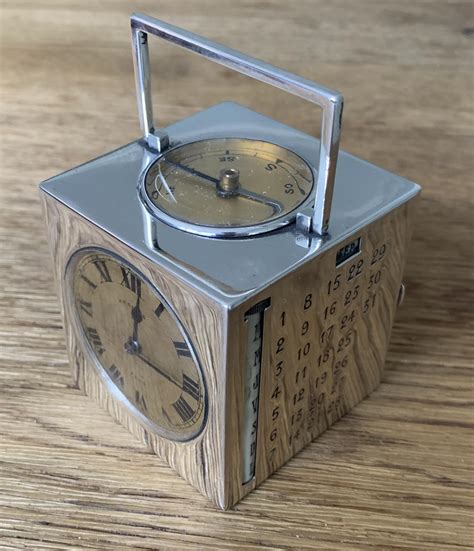 A Very Rare Silver Clock Barometer Compass Perpetual Calendar And