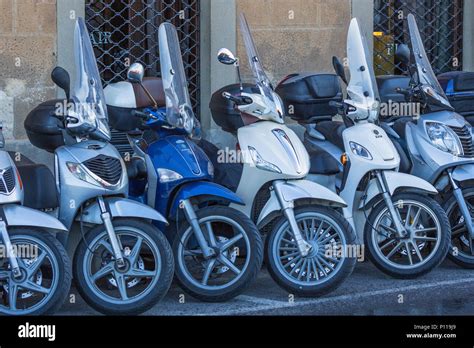 Scooters Parked On A City Street Stock Photo Alamy