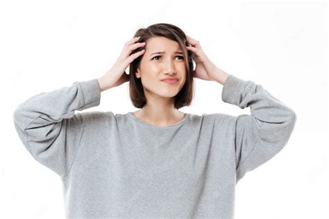 Free Photo Young Confused Woman Keeping Her Hands On Head