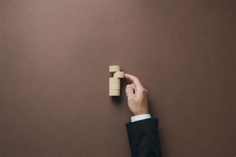 Premium Photo Hand Of A Businessman Pushing A Blank Wooden Cut Circle