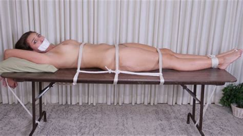 gorgeous naked amazon bella rolland is tied down to a table gagged on camera and groped 4k