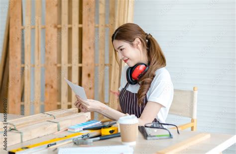 Asian Professional Cheerful Female Carpenter Worker Staff In Apron With