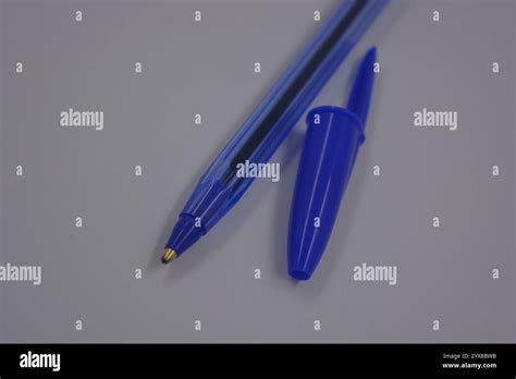 Things Objects That Are Constantly Used In Work Study A Clear Blue Plastic Pen With Ink And A Things Objects That Are Constantly Used In Work Study A Clear Blue Plastic Pen With Ink And A