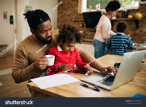 Black Working Father Using Laptop While Stock Photo 1871454754 Shutterstock