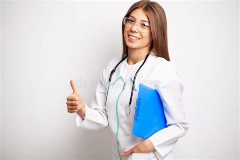 Doctor In A White Coat Holding A Pill For A Healthy Sex Life Of Men
