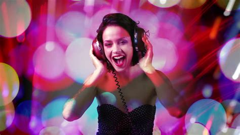 A Sexy Gogo Dancer Shot In A Studio Dancing Agaisnt Green Screen With Disco Style Background