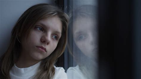 Young Sad Girl Looking Out Of Window Close Up Stock Footage Sbv