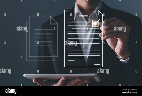 A Businessman Using A Pen Signing Electronic Documents On Digital