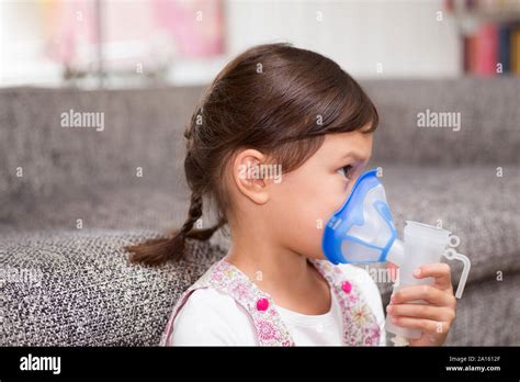 Girl Using Inhaler Stock Photo Alamy