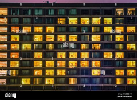 Building Facade Shows Windows And Rooms Pattern At Night The Exterior