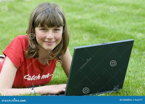 Teenager With Computer On The Grass Stock Image Image Of Hair Girl