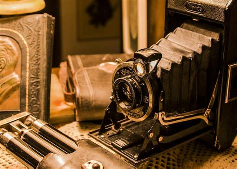 Premium Photo Close Up Of Vintage Camera On Table