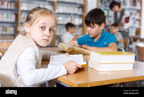 Tween Girl In School Library Stock Photo Alamy