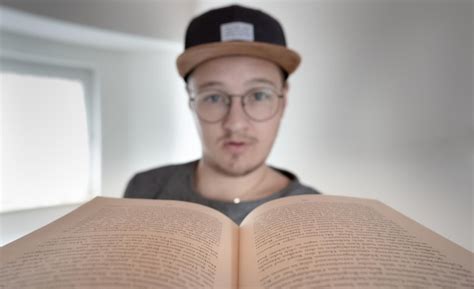 Premium Photo Portrait Of Man Reading Book