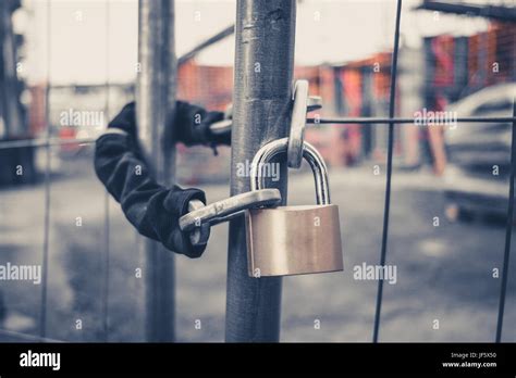 Chain And Padlock On Gate At Construction Site Lock On Closed Fence