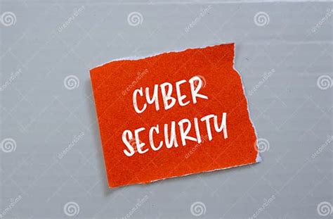 Cyber Security Message Written On Ripped Torn Orange Paper Piece With