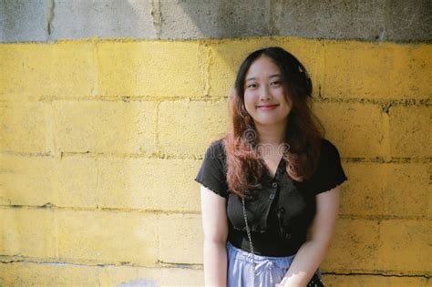 Portrait Of Chubby Asian Woman Standing Outdoor Against Japanese