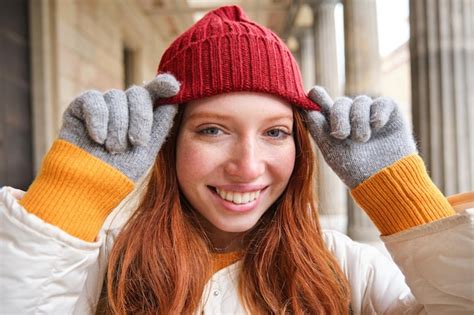 Free Photo Headshot Of Happy Redhead Girl With Freckles Wears Red Hat