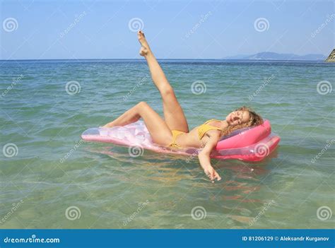 Young Girl Floating On A Mattress In The Sea Stock Image Image Of
