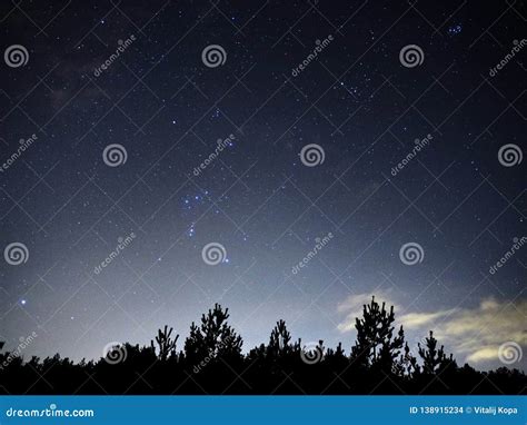 Orion Constellation And Open Cluster Pleiades On Night Sky Stock Photo