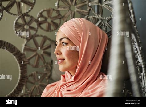 Pretty Smiling Pensive Young Woman With Freckles Wearing Light Pink