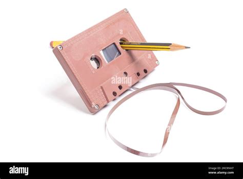 Audio Cassette Tape With Pencil Isolated On White Background Vintage