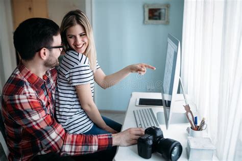 Young Attractive Designers Working On Project Together Stock Image Image Of Couple Happy