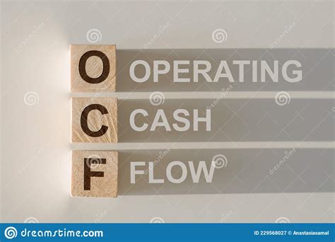 OCF Operation Cash Flow Acronym On Wooden Cubes On Columns Of
