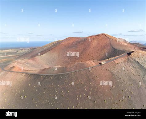 Drone Ariel View Of Volcano With Green Patches At Timanfaya National