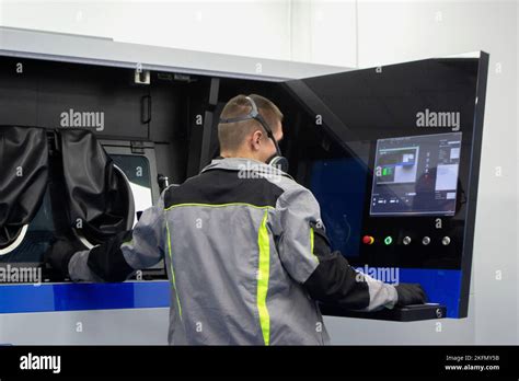 The Worker Controls Workflow Inside Large Industrial 3d Printer