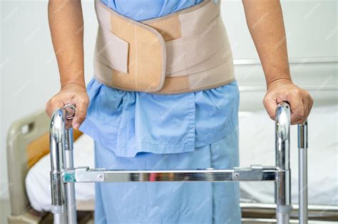 Premium Photo Asian Lady Patient Use Walker In Hospital To Support